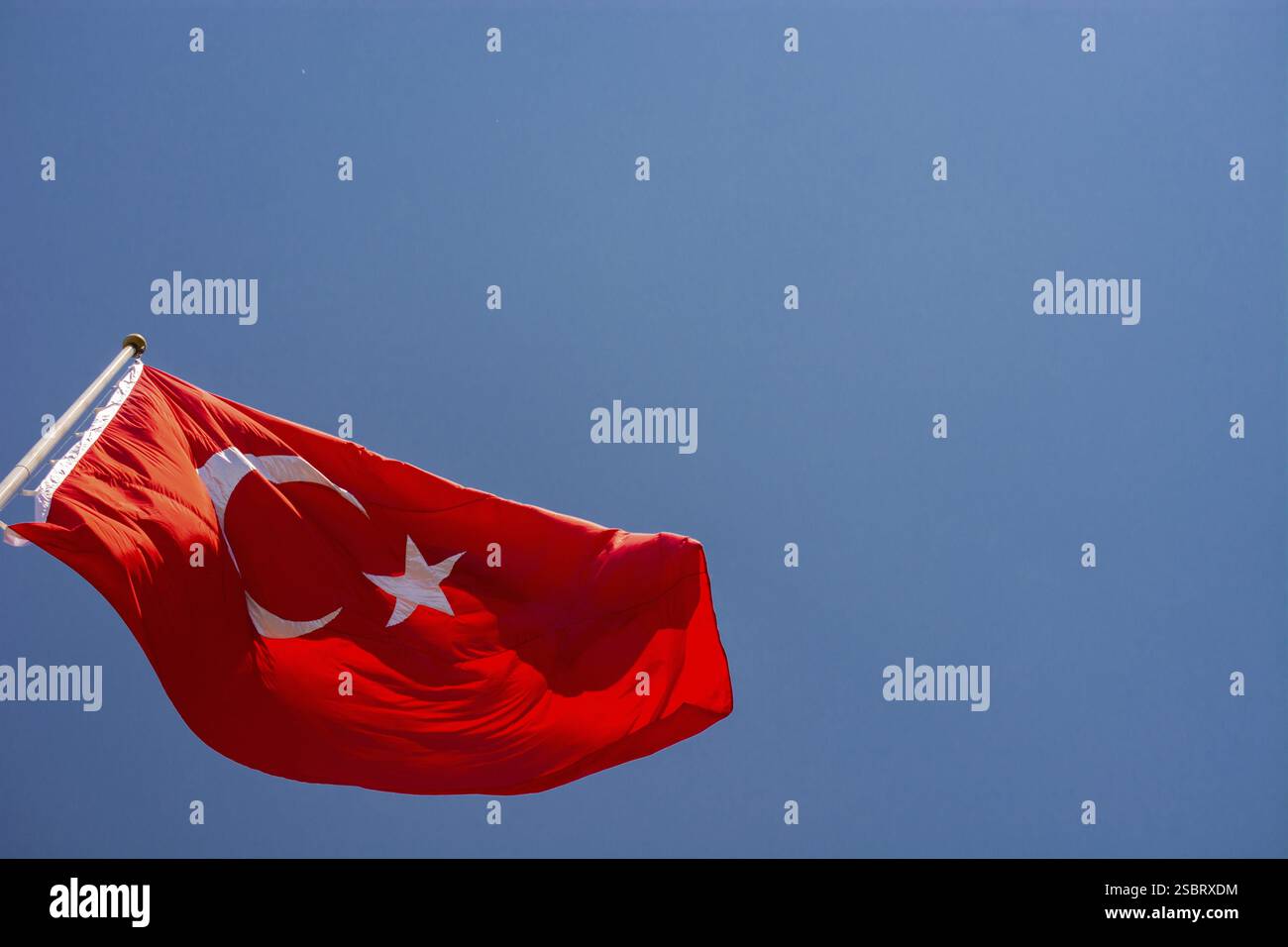 Turkish national flag with white star and moon on a pole in sky Stock ...