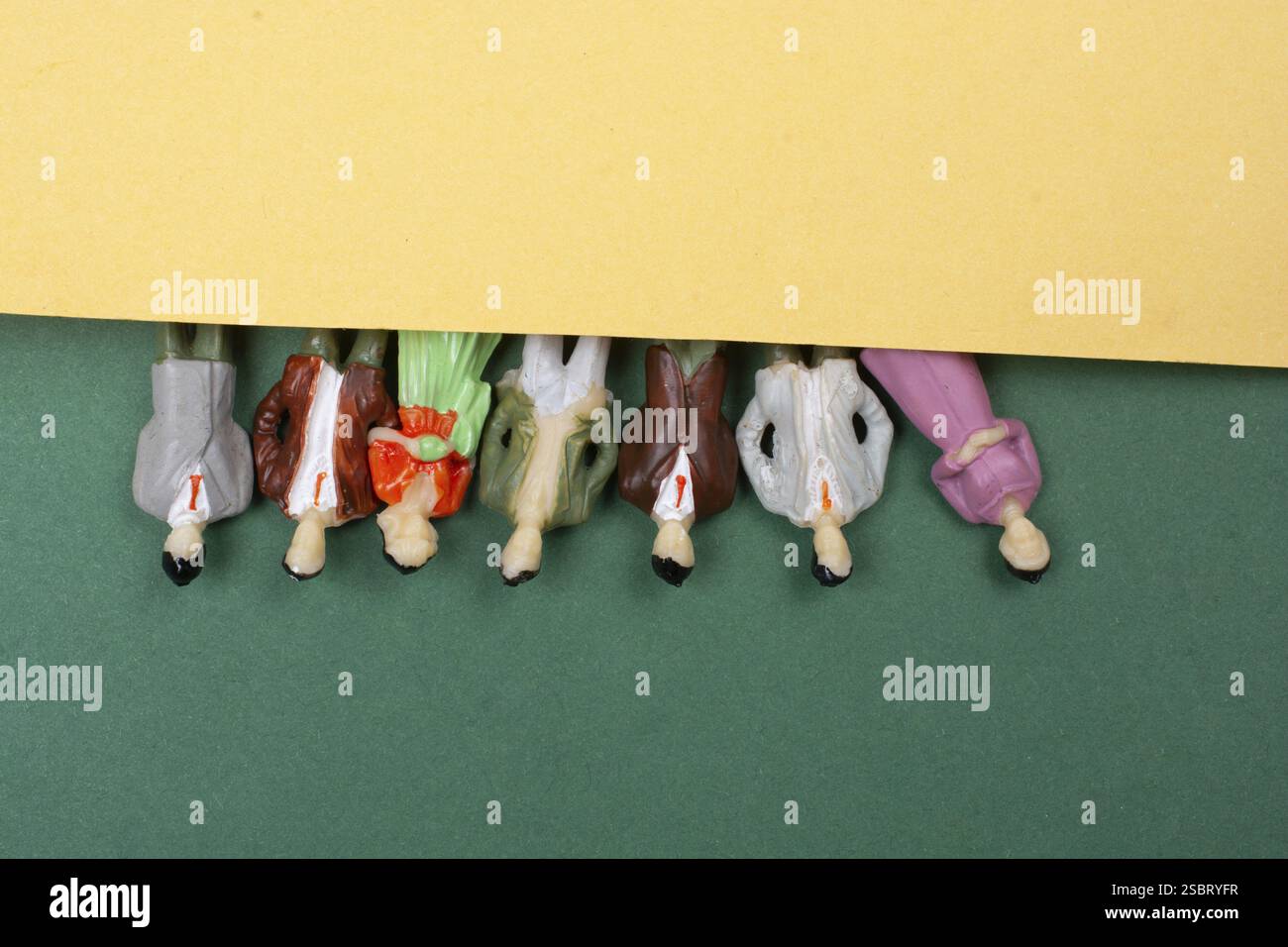 Colorful diverse miniature people figurines make crowd on ground Stock ...