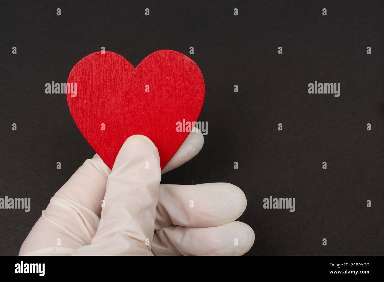 Sterile gloved hands holding hi-res stock photography and images - Alamy