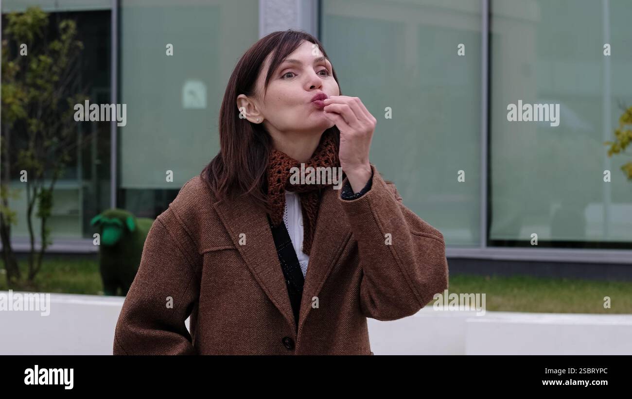 A senior woman expressing humor and affection with an exaggerated ...