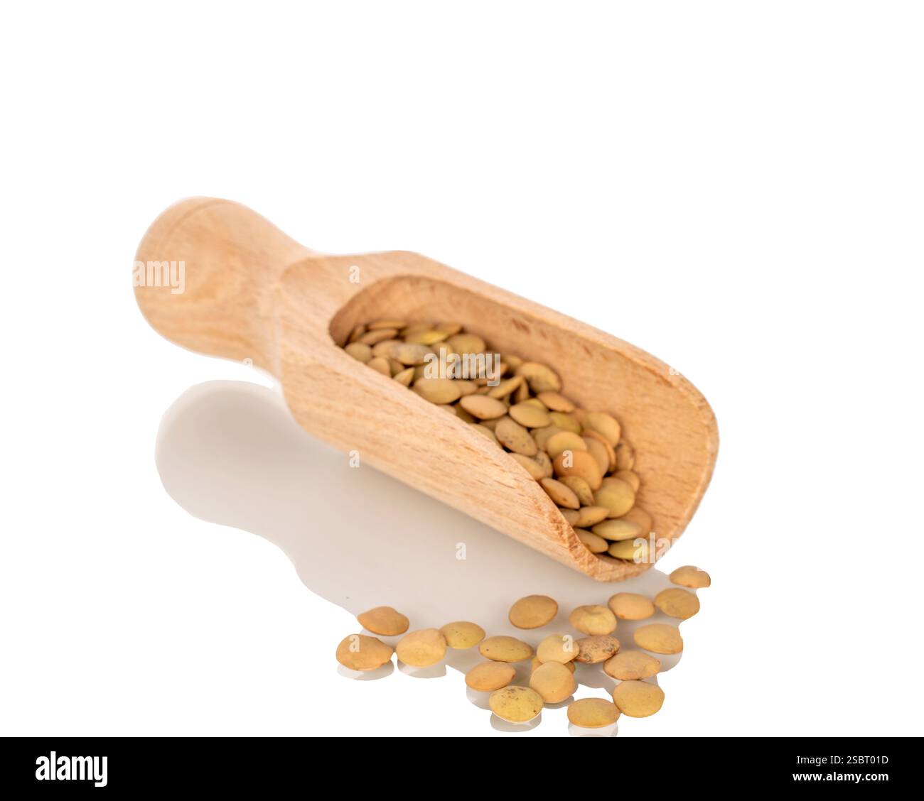 Raw lentils with wooden spoon, isolated on white background, macro Stock Photo - Alamy