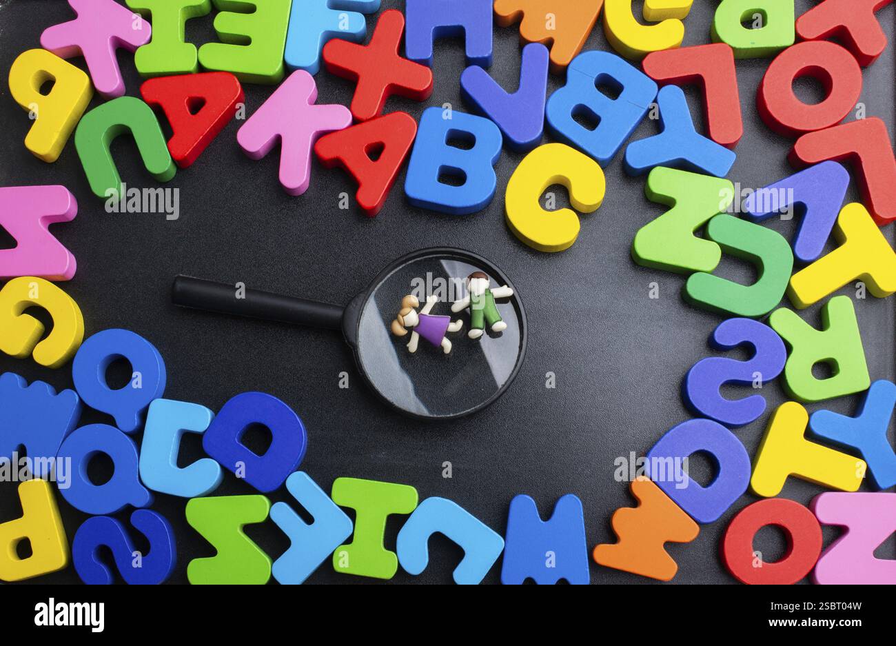 Kids over Magnifying glass and Colorful Letters of Alphabet Stock Photo ...