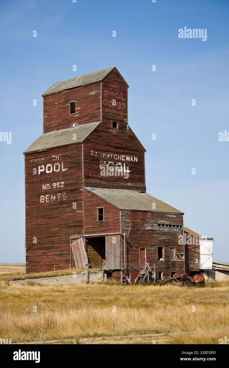 A large, old red barn with a pool on the side. The pool is located on ...