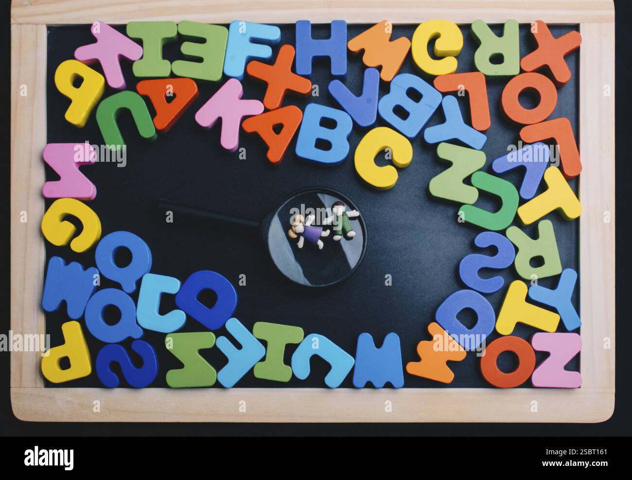 Kids over Magnifying glass and Colorful Letters of Alphabet Stock Photo ...