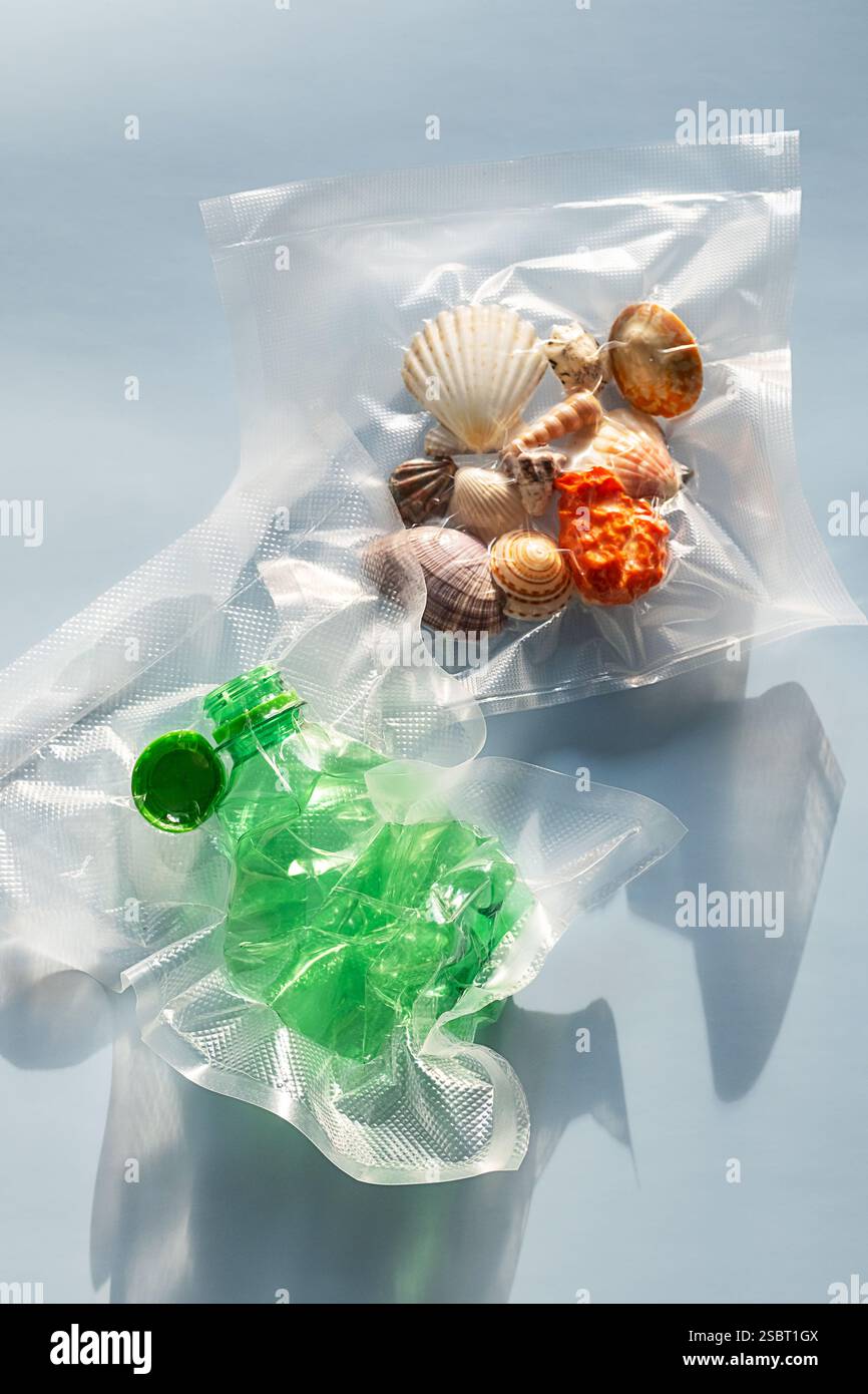 Sea shells and plastic bottle vacuum-sealed pack. Nature vs plastic ...