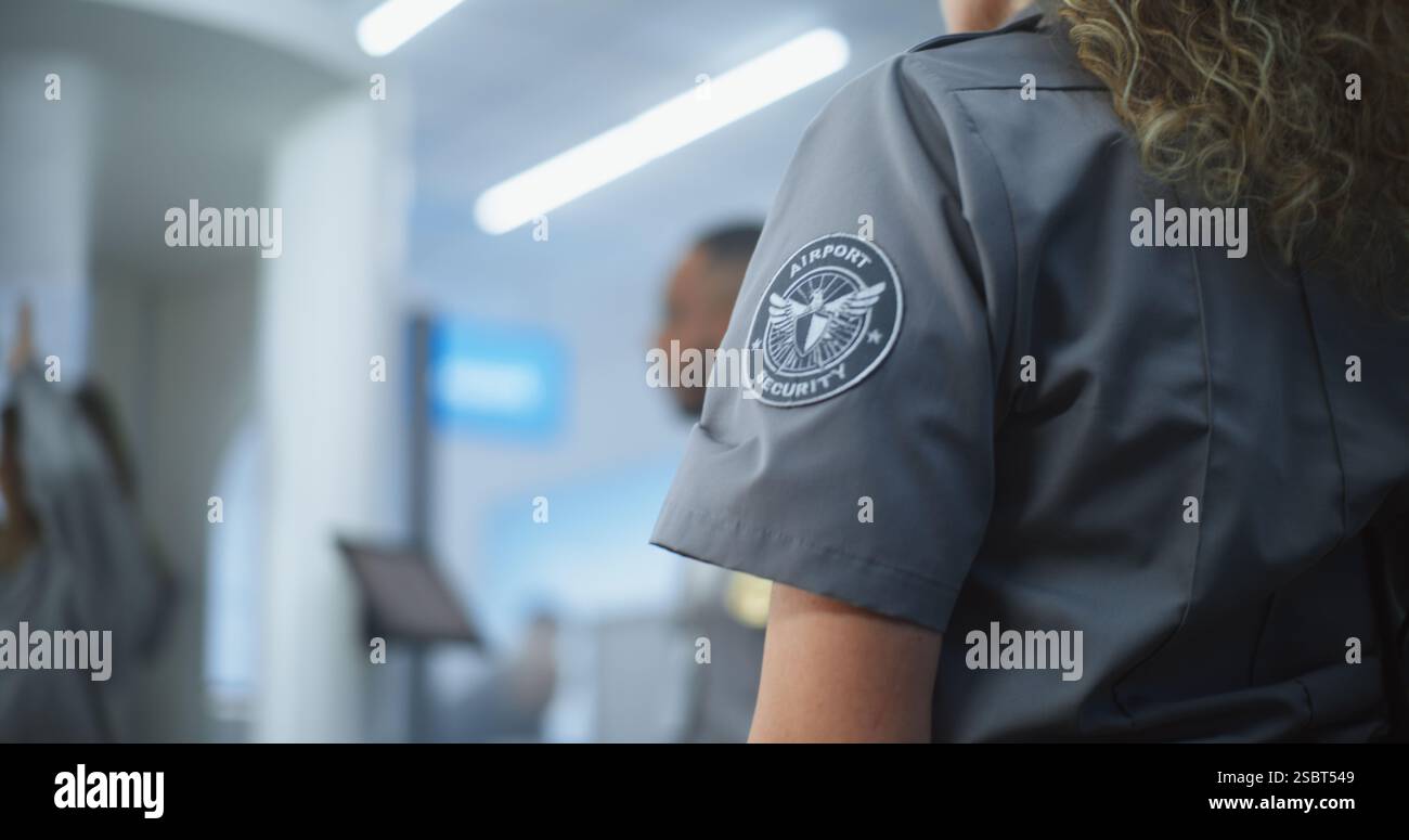 Airport Security Checkpoint: Female Security Officer Inspects Young ...
