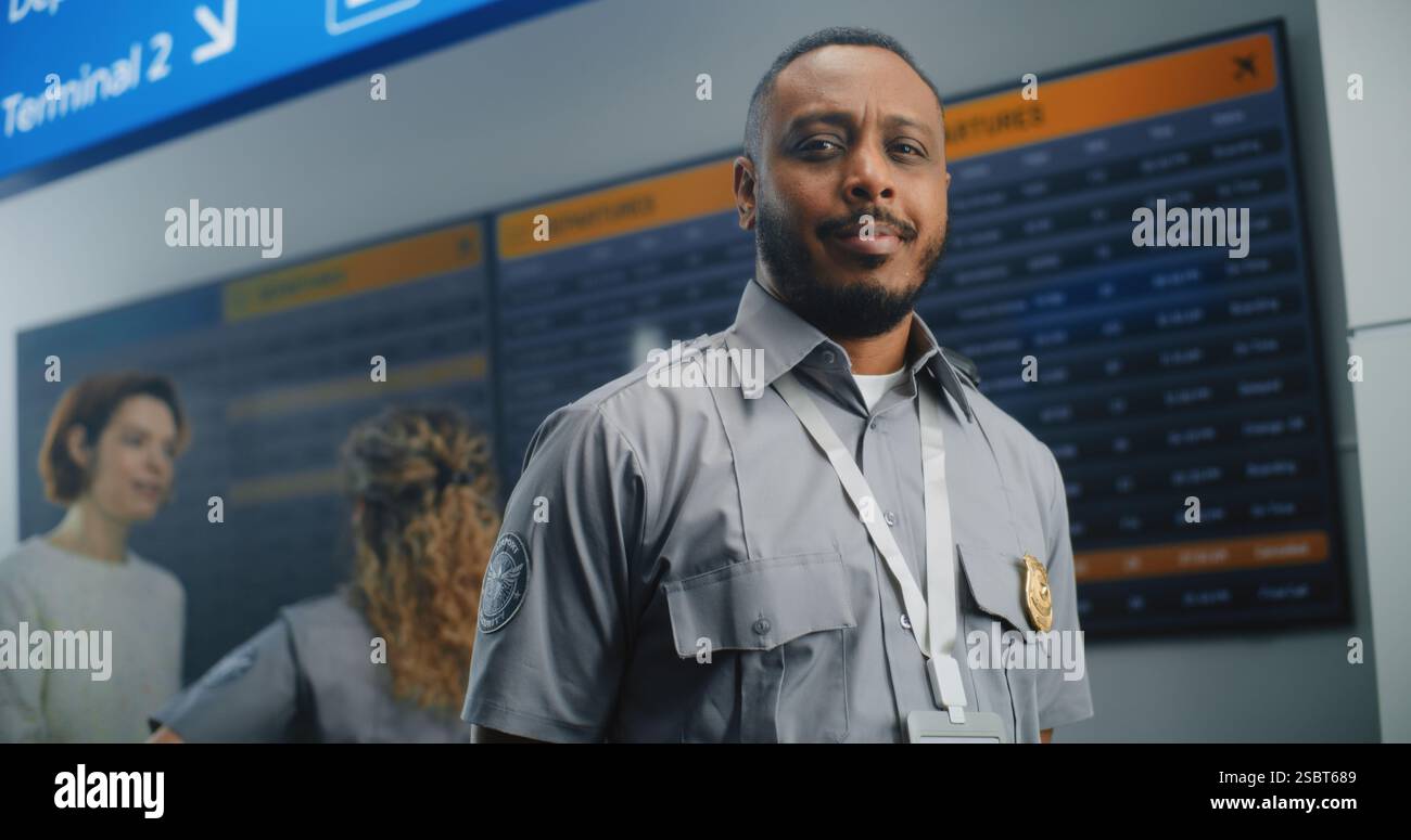 Portrait of Security Officer in Airport Terminal: African American TSA ...