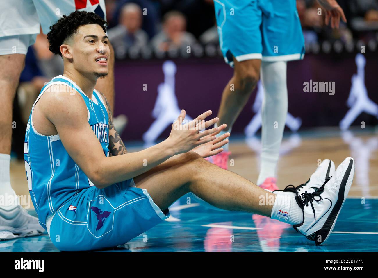 Charlotte Hornets guard KJ Simpson reacts after drawing a charge during ...