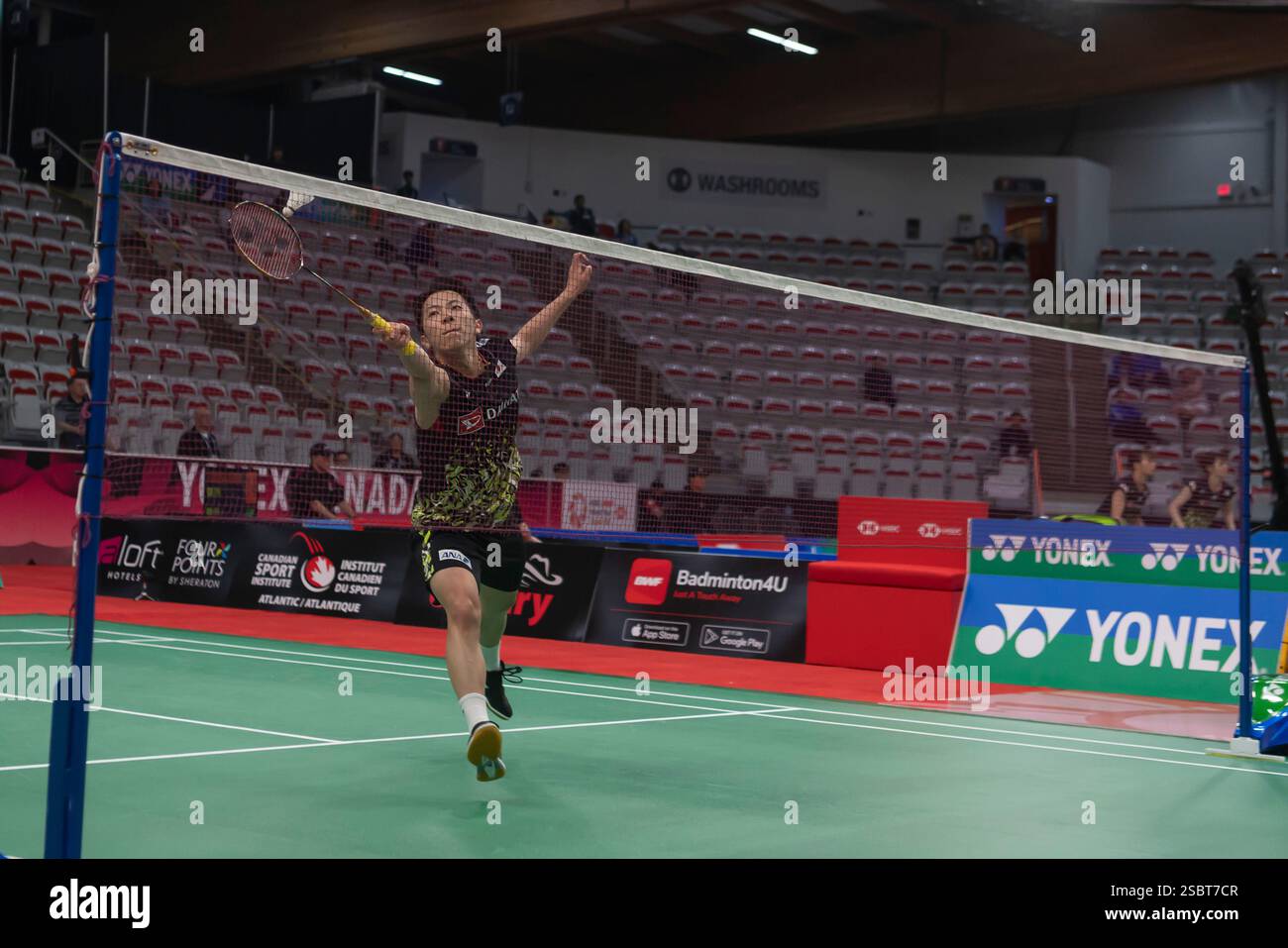 Li Shi Feng (China) compete against Koki Watanabe (Japan) in men's singles match at the 2023 BWF ...