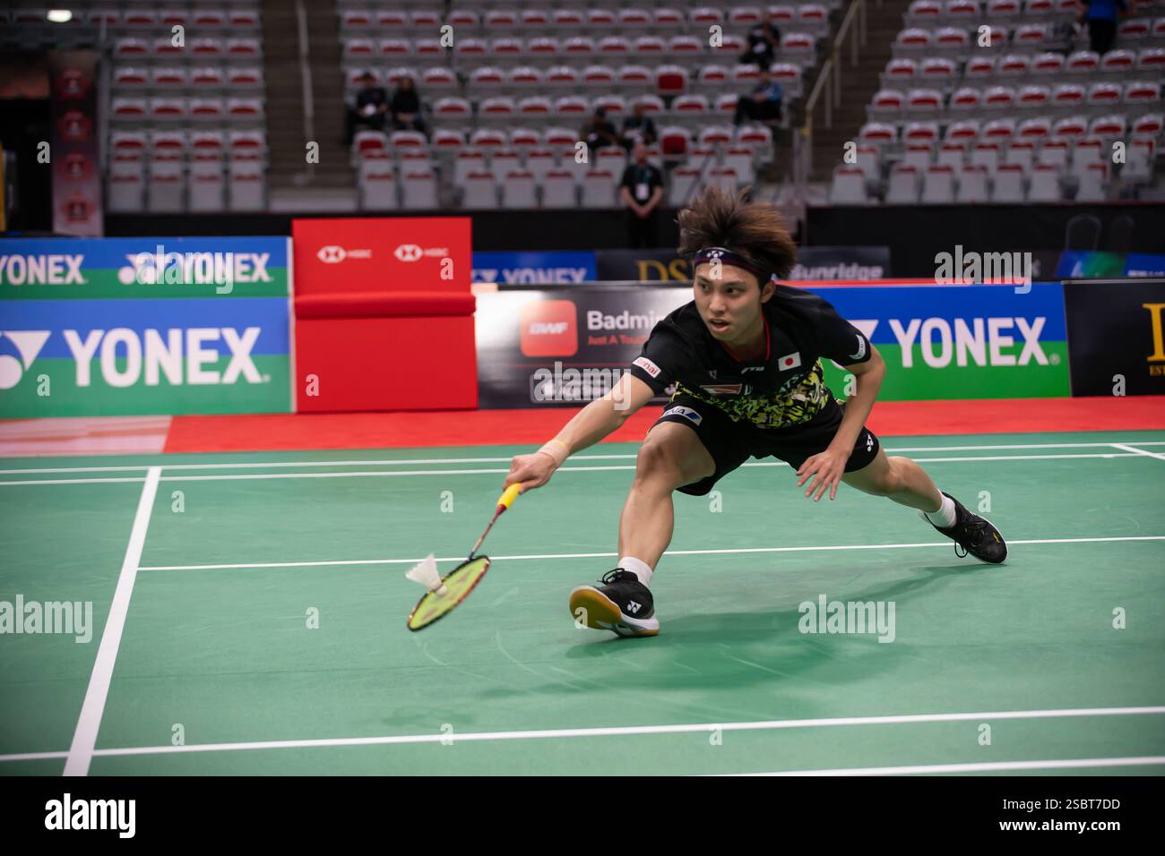 Kodai Naraoka (Japan) compete against Lei Lan Xi (China) at the 2023 BWF Championships Stock ...