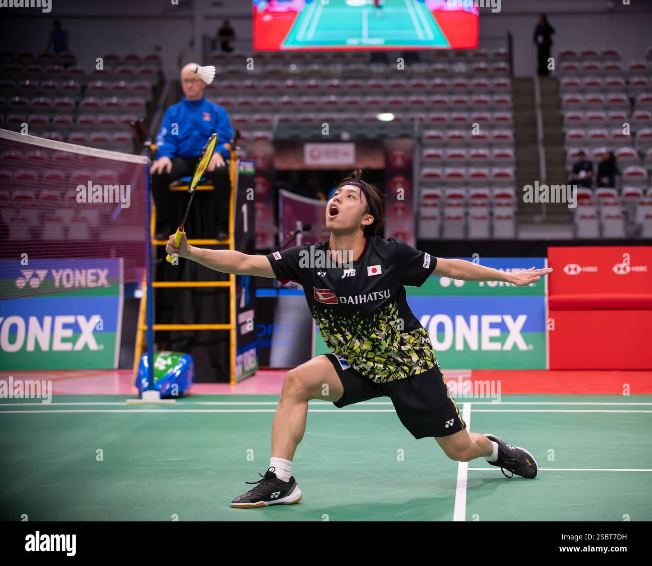 Kodai Naraoka (Japan) compete against Lei Lan Xi (China) at the 2023 BWF Championships Stock ...