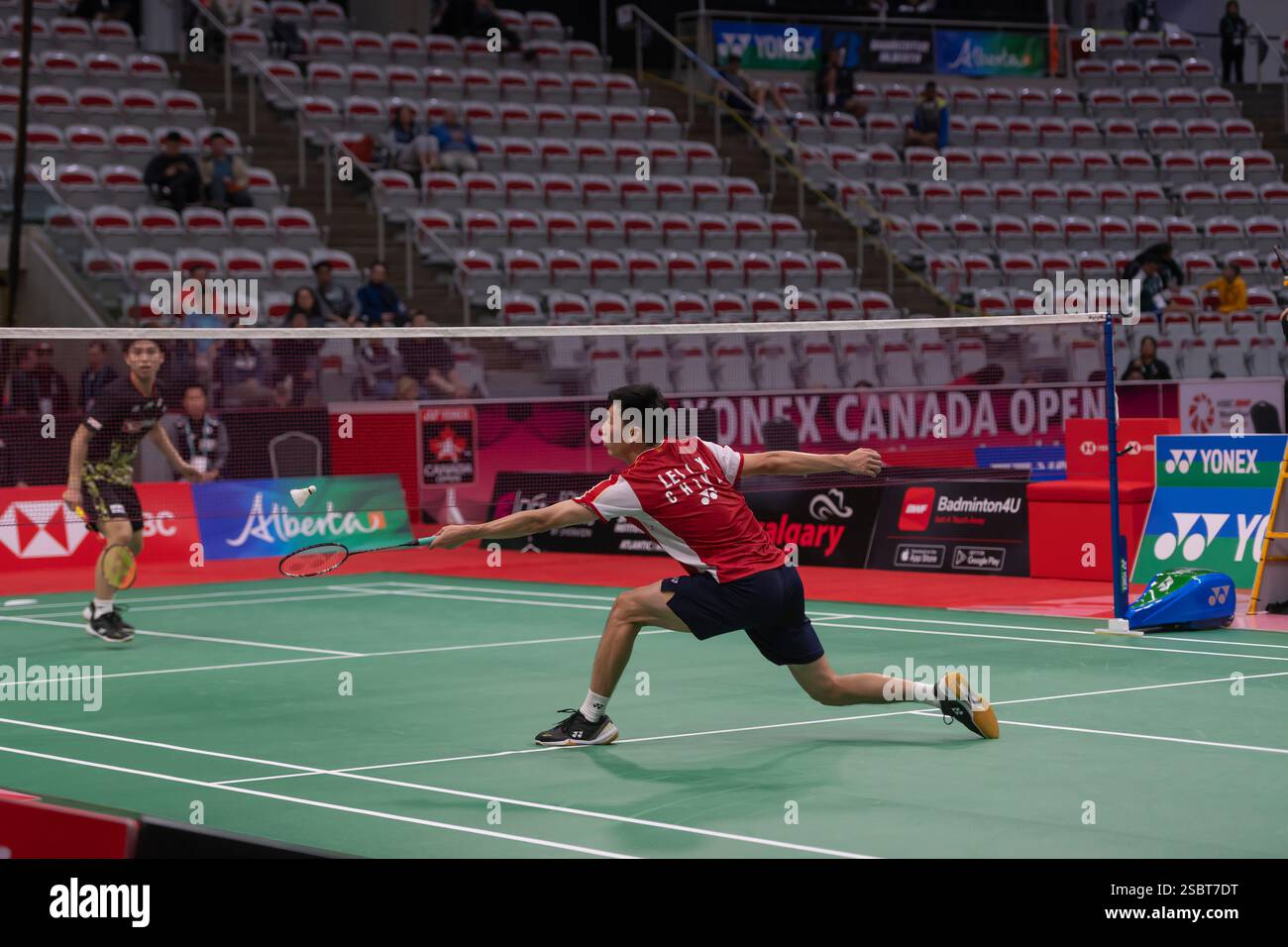 Kodai Naraoka (Japan) compete against Lei Lan Xi (China) at the 2023 BWF Championships Stock ...