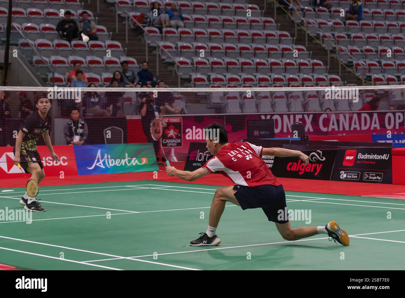 Kodai Naraoka (Japan) compete against Lei Lan Xi (China) at the 2023 BWF Championships Stock ...