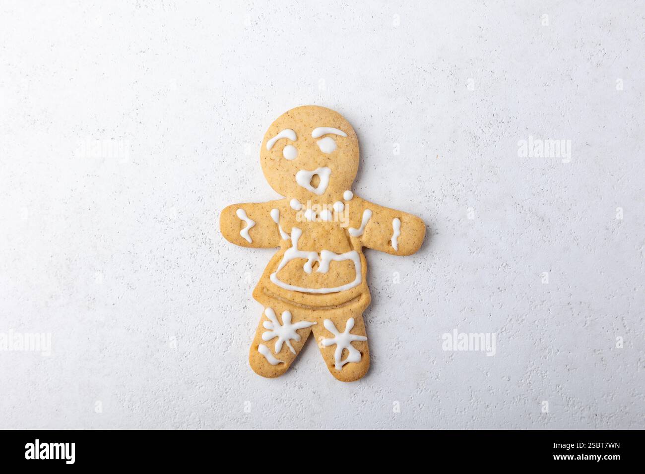 Gingerbread man with a surprised face decorated with white icing ...