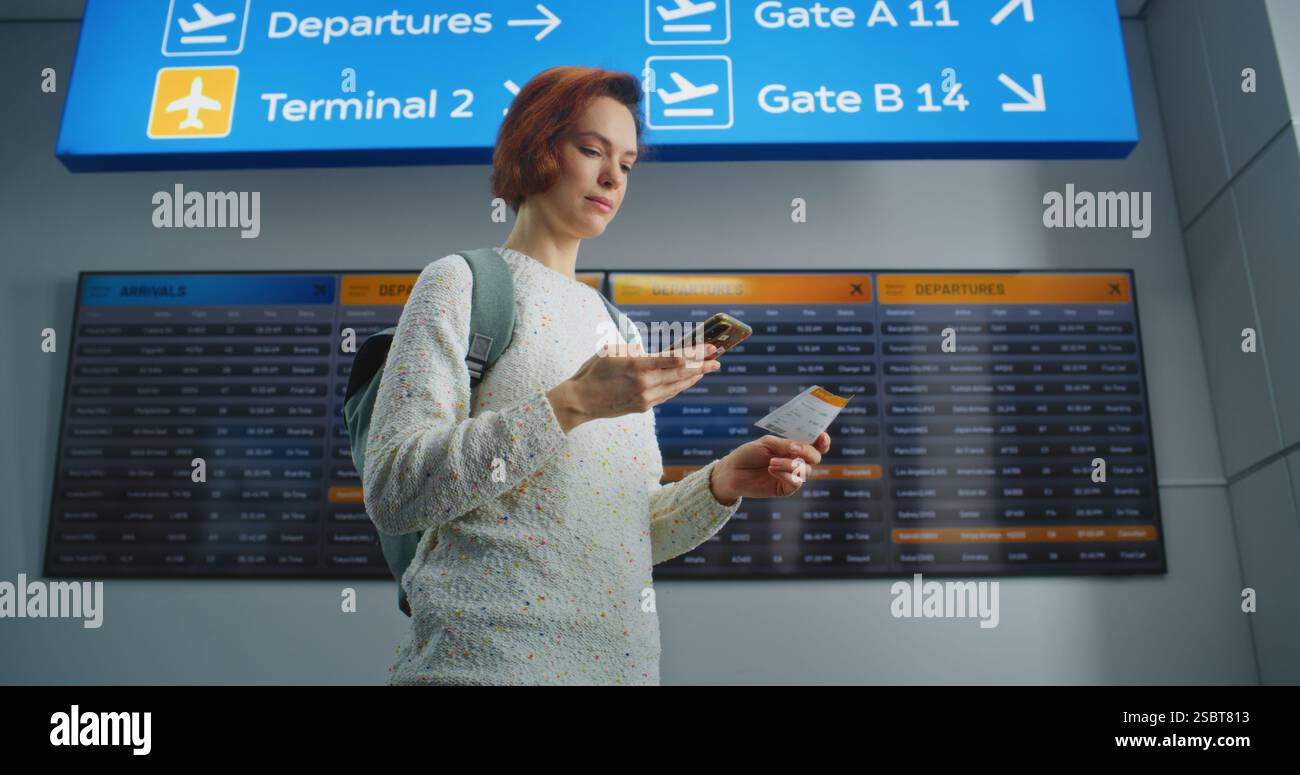 Airport Terminal: Happy Woman Scanning Plane Ticket Using Smartphone ...