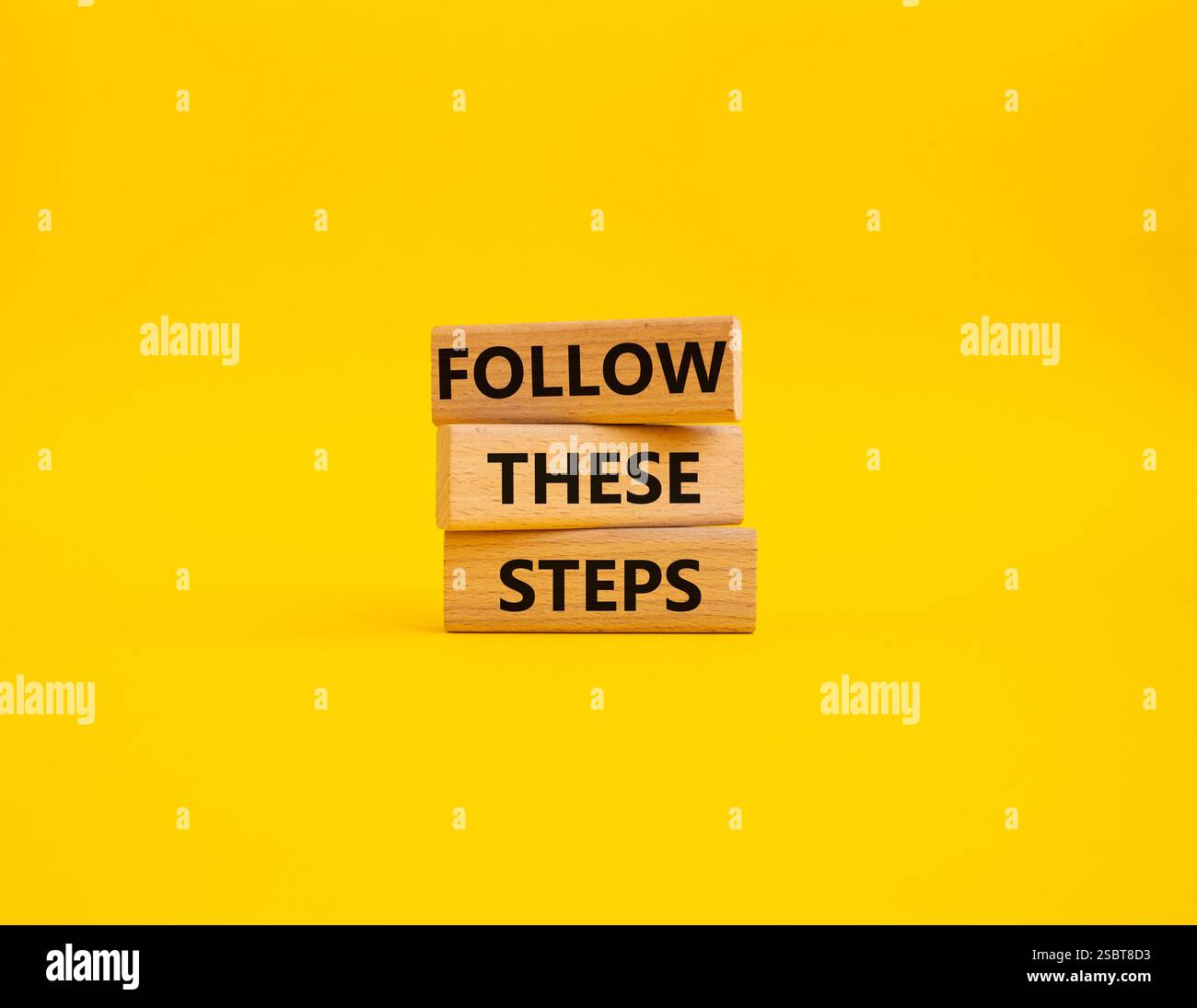 Follow these steps symbol. Wooden blocks with words Follow these steps ...