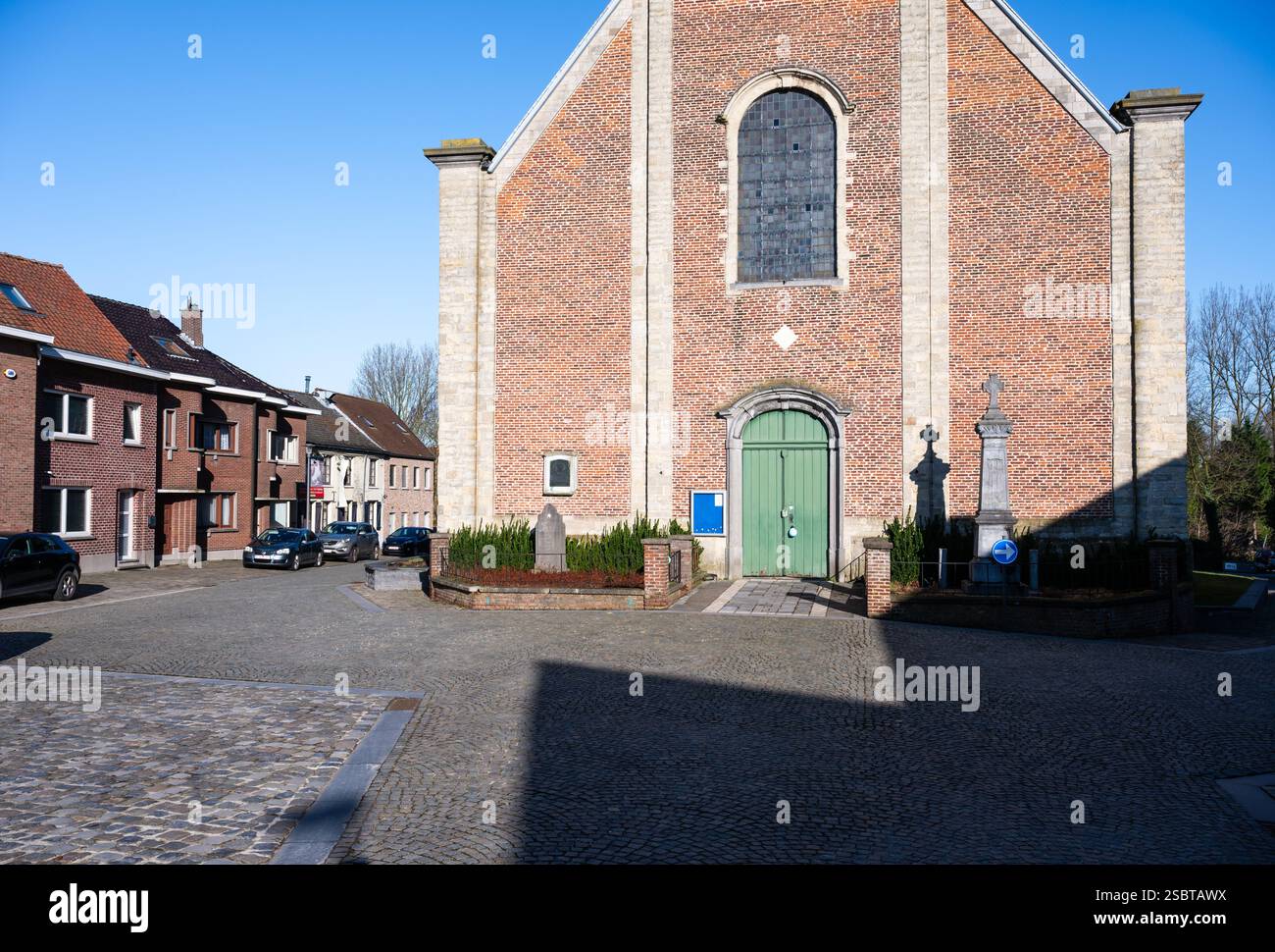 The Saint Stephen catholic church in the village center of Brussegem ...