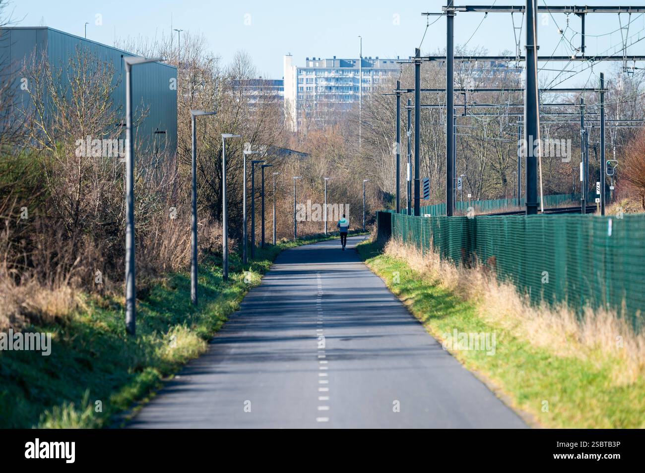 The F212 fast cycling lane or fietssnelweg, a double asphalt lane along ...