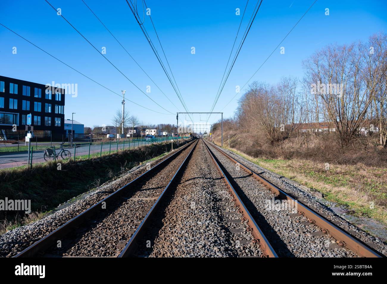 Double railway tracks of a local line at the Belgian countryside ...