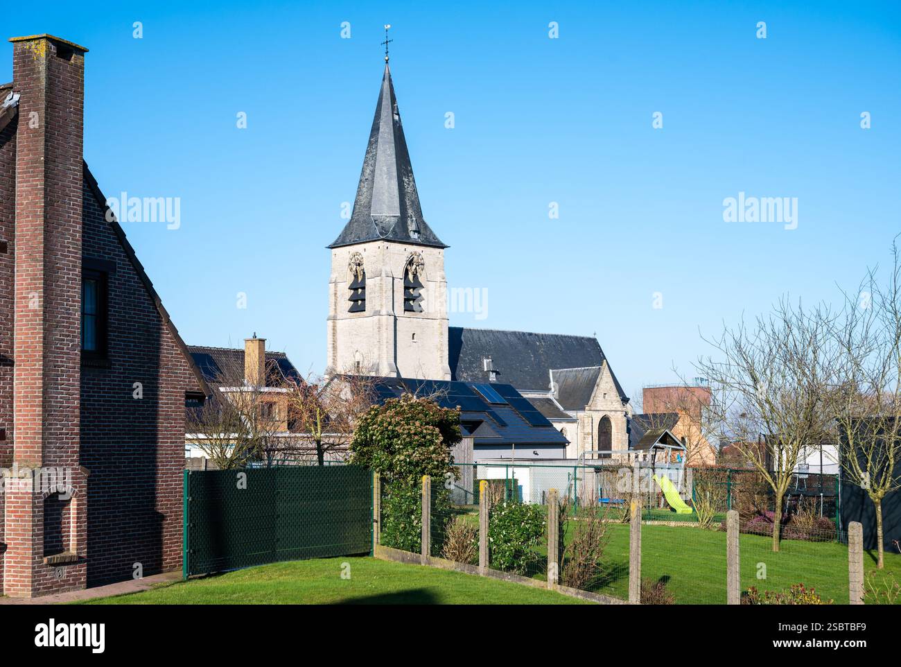 The Saint Stephen catholic church in the village center of Brussegem ...