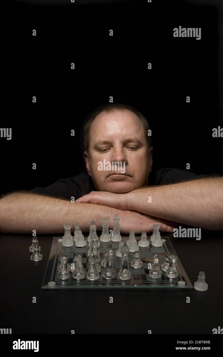 A man involved in a competative chess match Stock Photo - Alamy