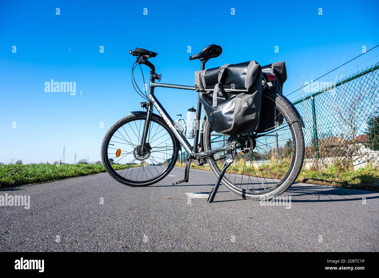 Trekking bike with paniers standing at the F212 fast cycling lane or ...