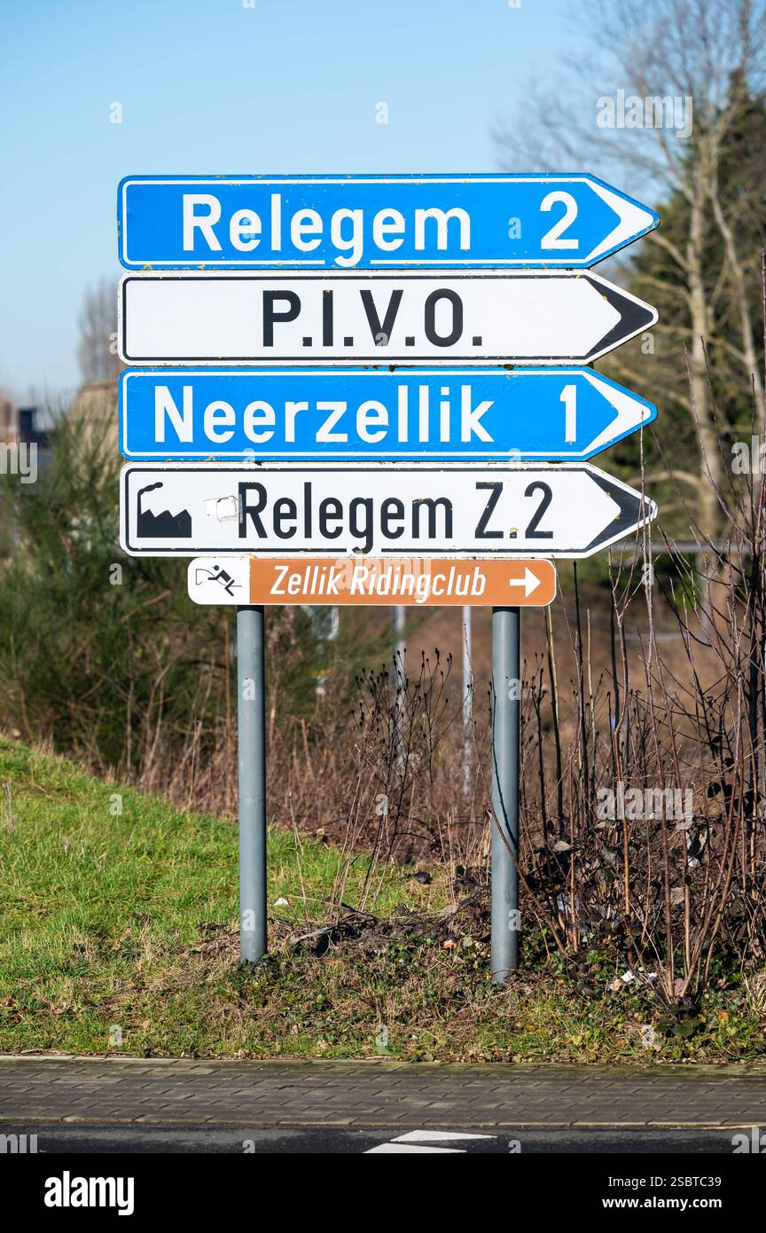 Blue direction sign to Relegem, PIVO and the Zellik Riging club in ...