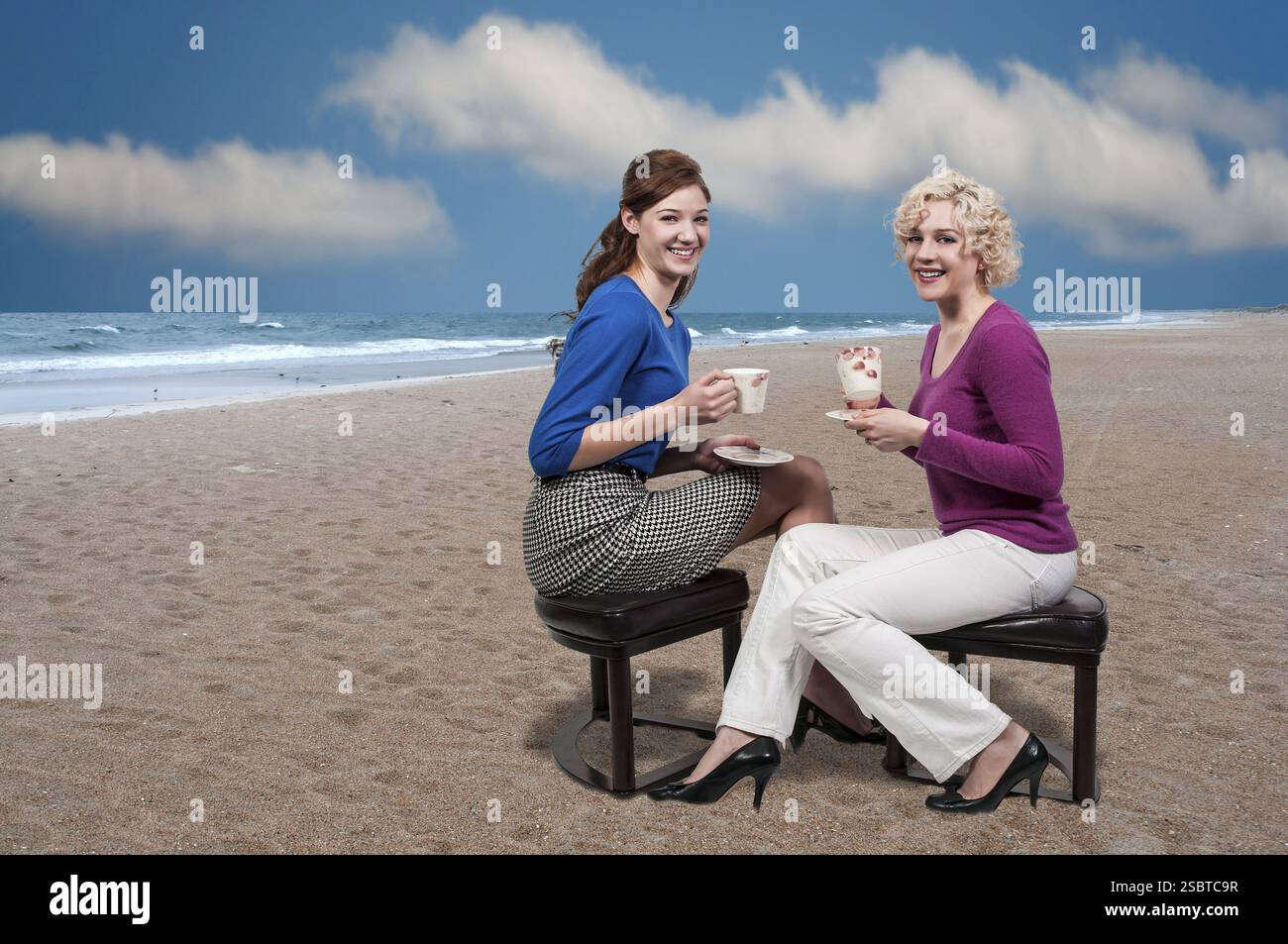 Beautiful women having a social tea party Stock Photo - Alamy