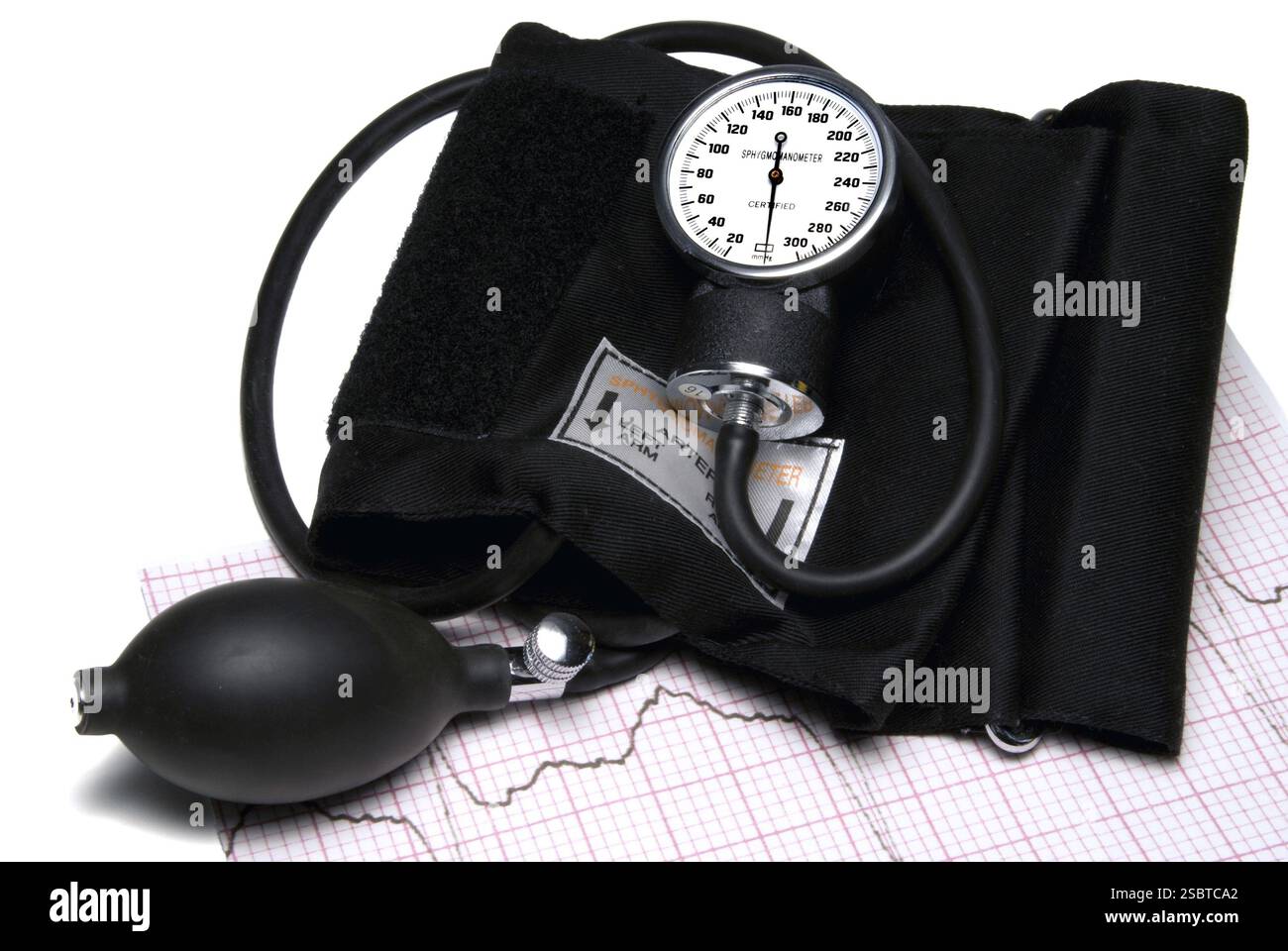 A Sphygmonanometer on top of a EKG readout Stock Photo - Alamy