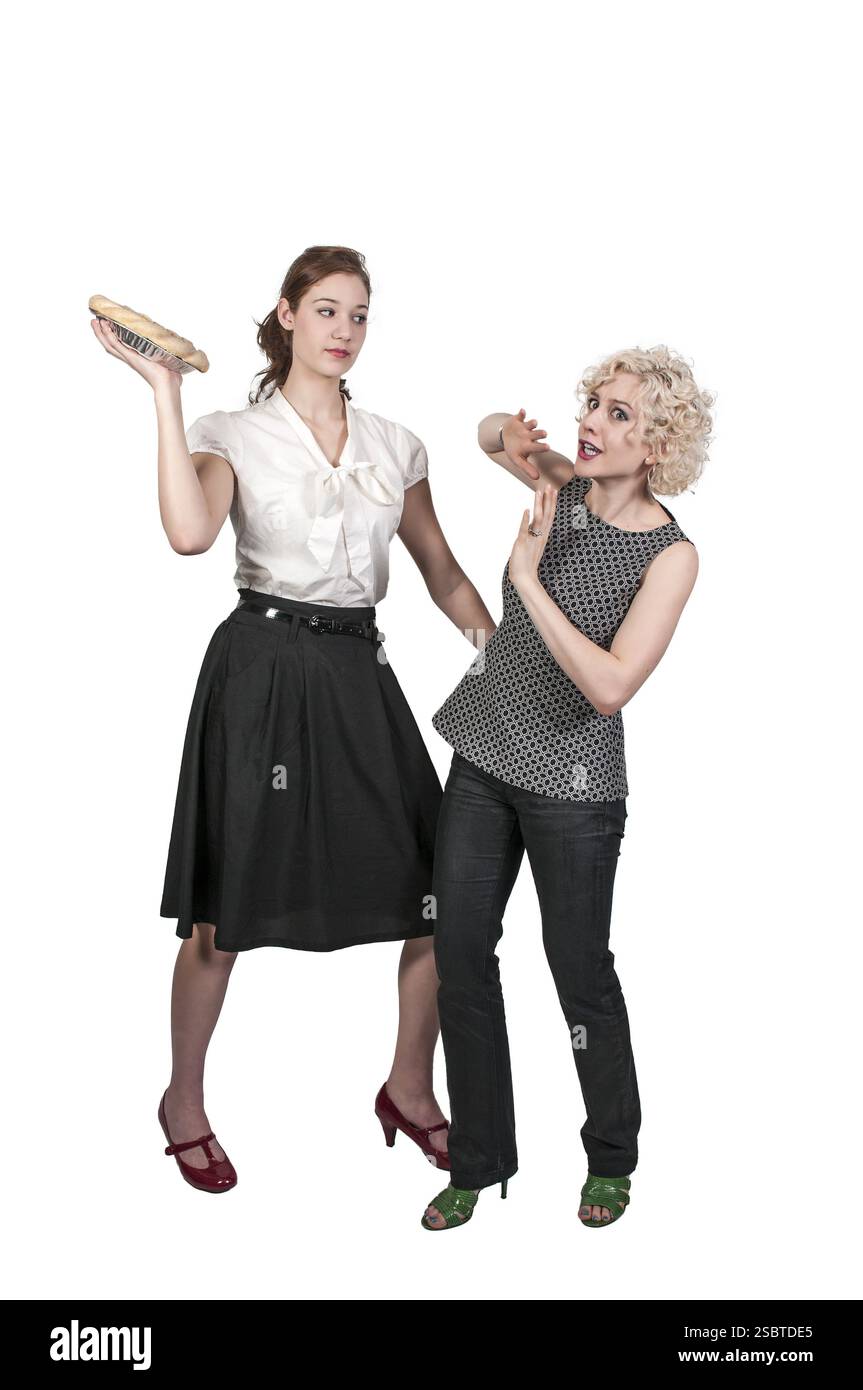Beautiful woman having a friendly pie fight Stock Photo - Alamy