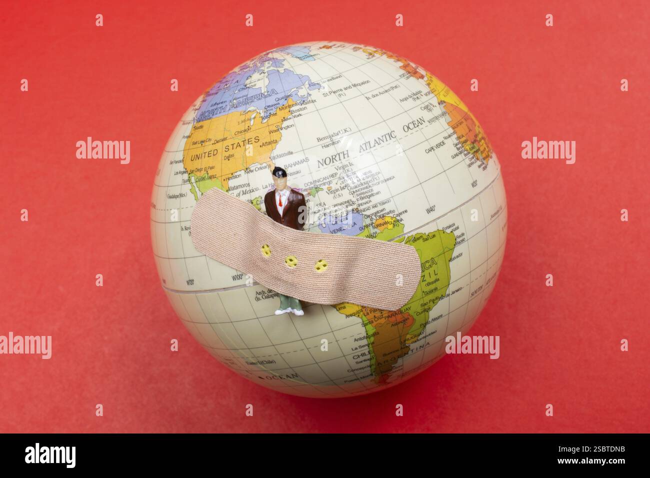 Earth with bandaid Solidarity and aid to countries in need concept ...