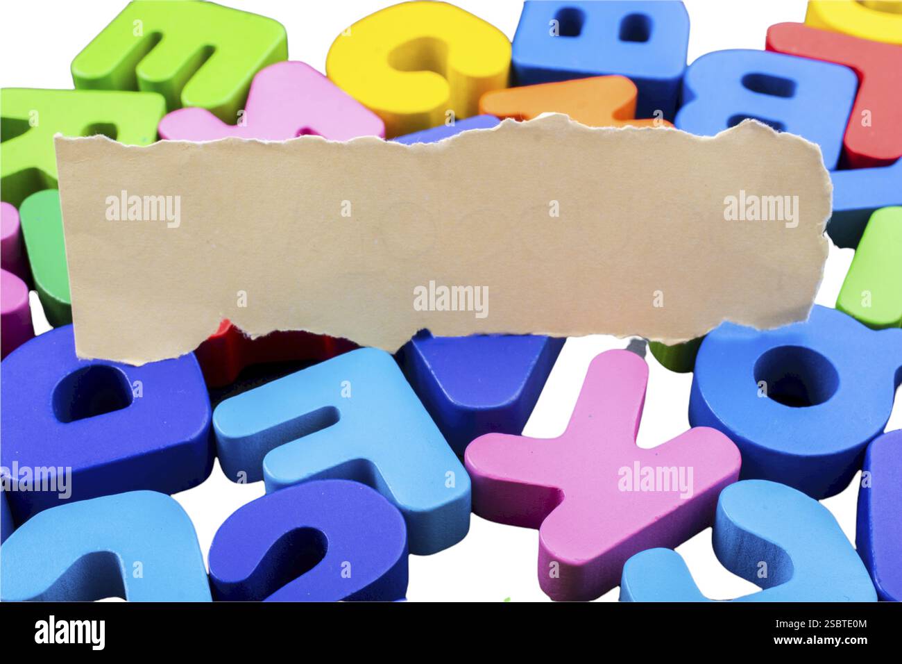 Colored wooden letters of the English alphabet on a white background ...