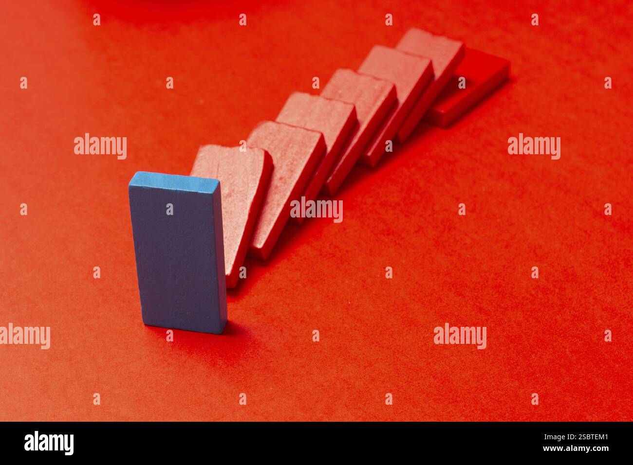 Colorful dominoes. Rainbow colored chain reaction Stock Photo - Alamy