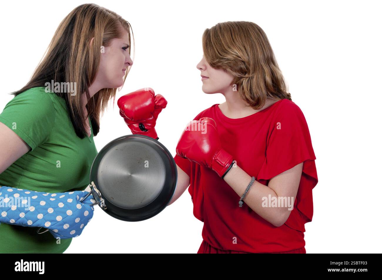 Two teenagers fighting over cooking techniques Stock Photo - Alamy