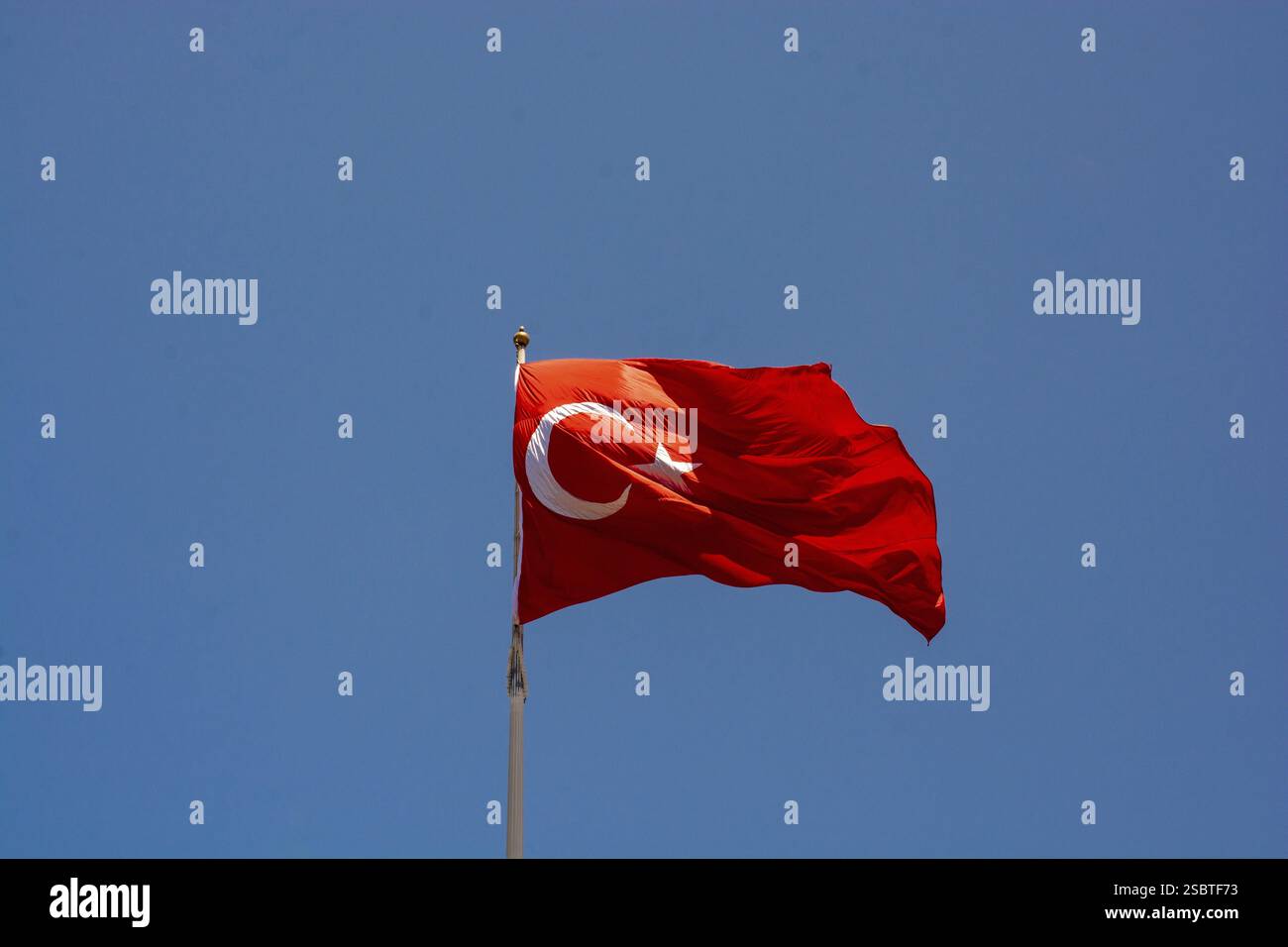 Turkish national flag with white star and moon on a pole in sky Stock ...