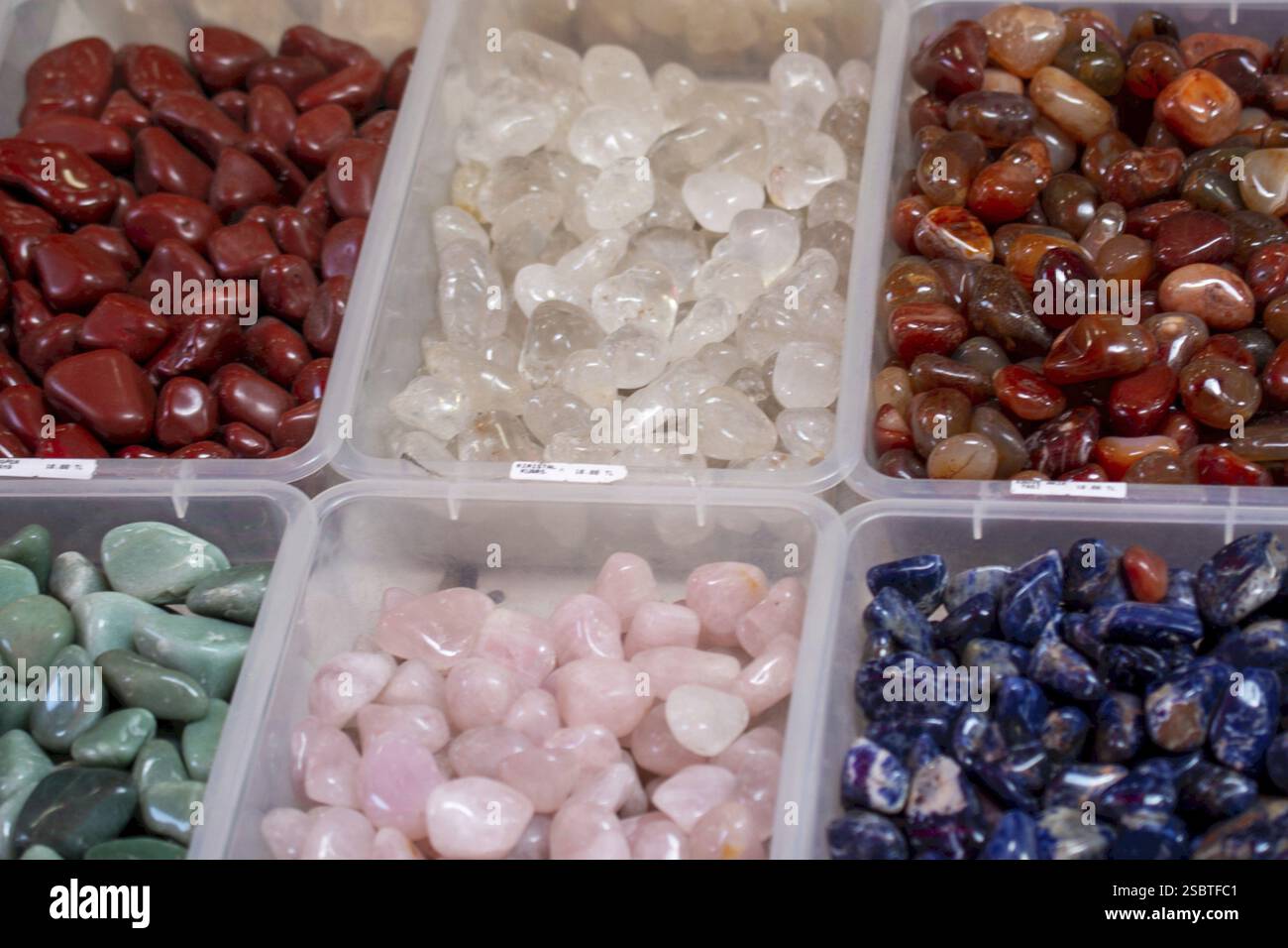 Colorful semi-precious stones. Different shapes rock pebbles. Semi ...