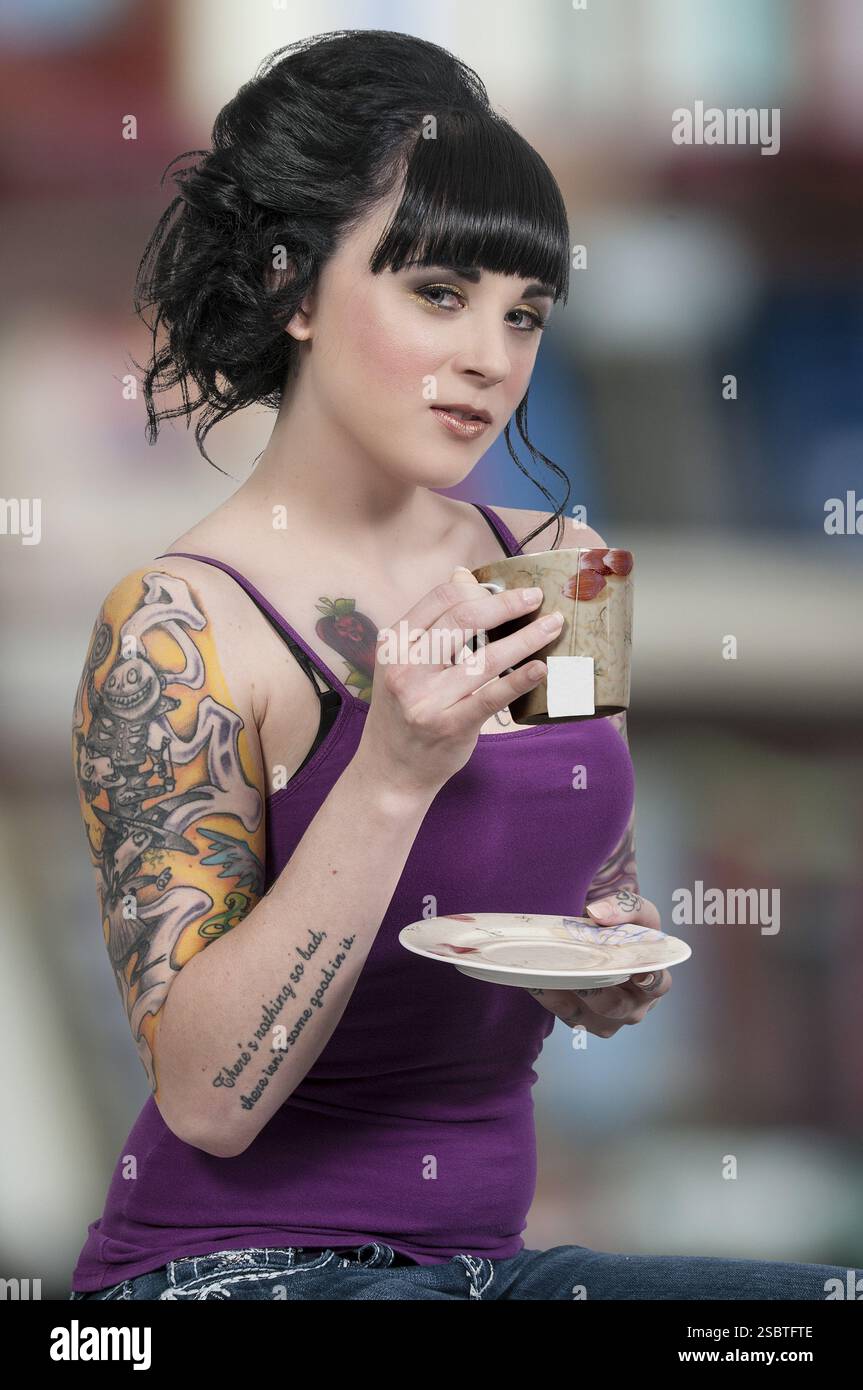 Beautiful women having a social tea party Stock Photo - Alamy