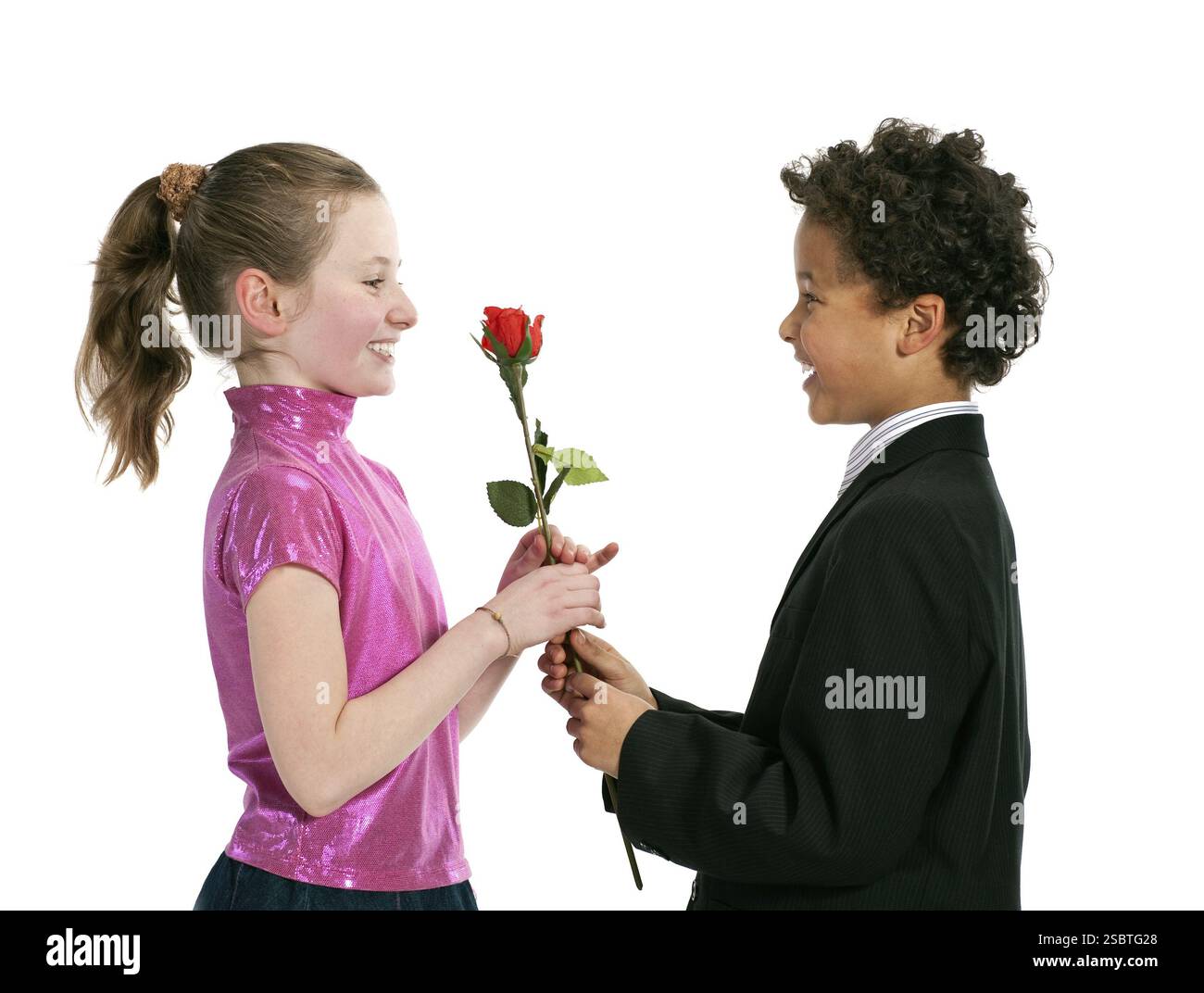Boy giving a rose to a girl, isolated on a white background Stock Photo ...