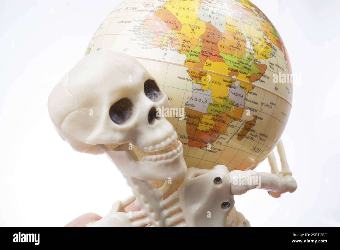The earth in a skeleton hand Stock Photo - Alamy