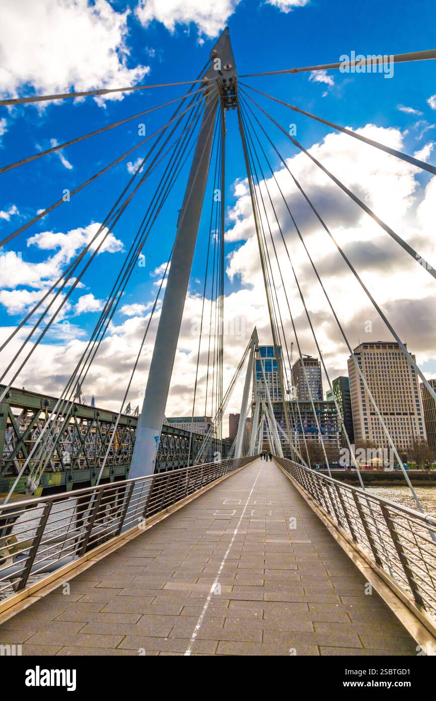 Walking on one of the Golden Jubilee Bridges in London, named in honour ...