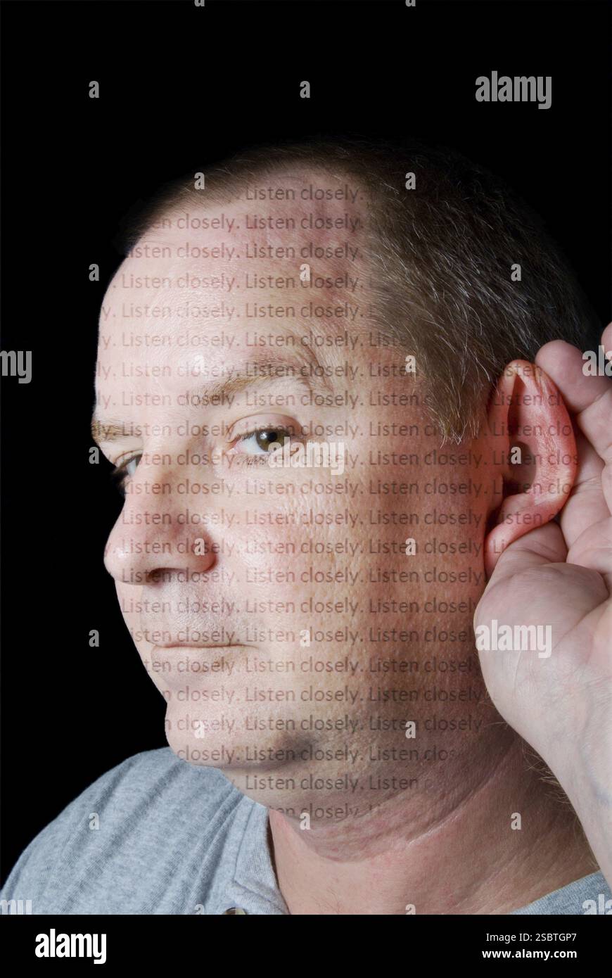 A Man Listening by cupping his ear with his hand Stock Photo - Alamy