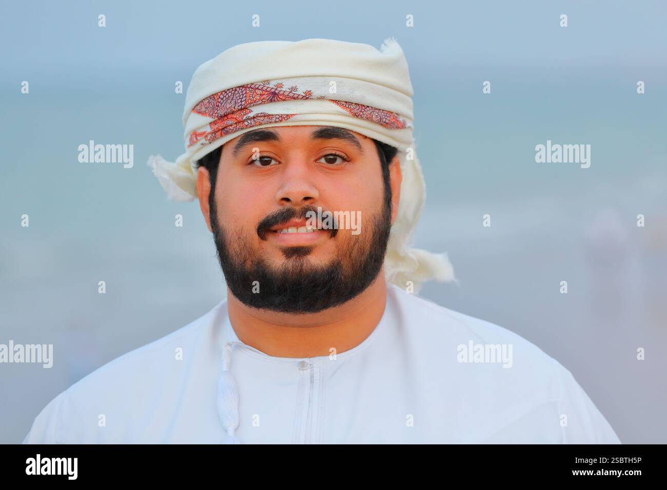 MUSCAT BEACH, MUSCAT, OMAN - DECEMBER 31, 2024: Portrait of a welcoming ...