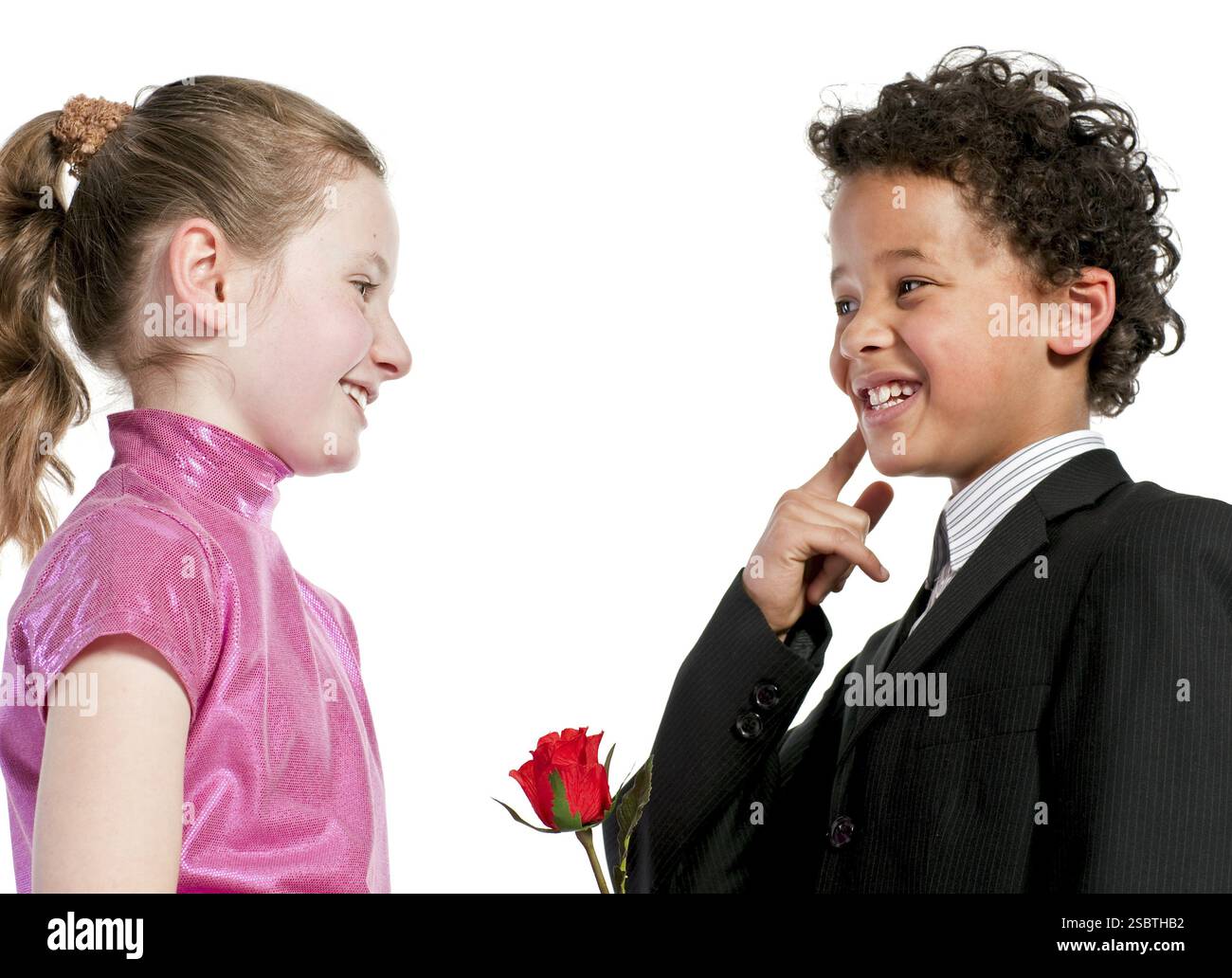 Boy giving a rose to a girl, isolated on a white background Stock Photo ...