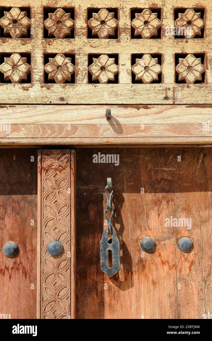 A typical old wooden door with carvings in Harat Al Bilaad, the ...
