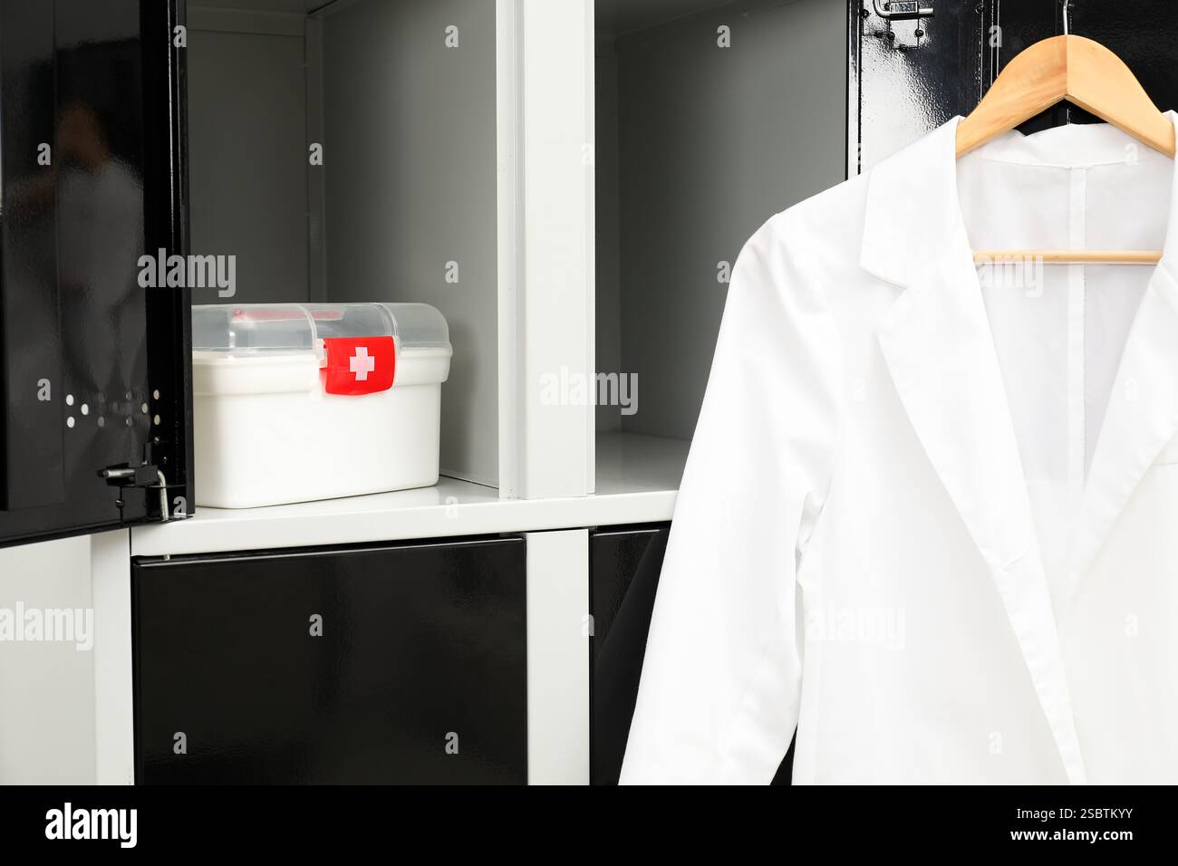 Medical personnel uniform on locker in changing room, closeup Stock ...