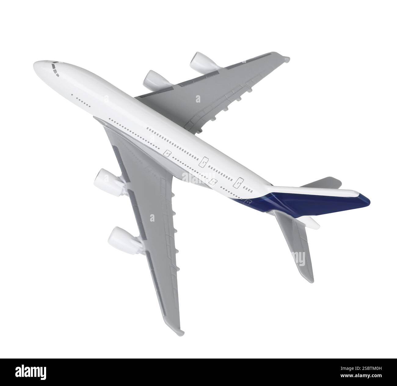Plane model in air on white background Stock Photo - Alamy