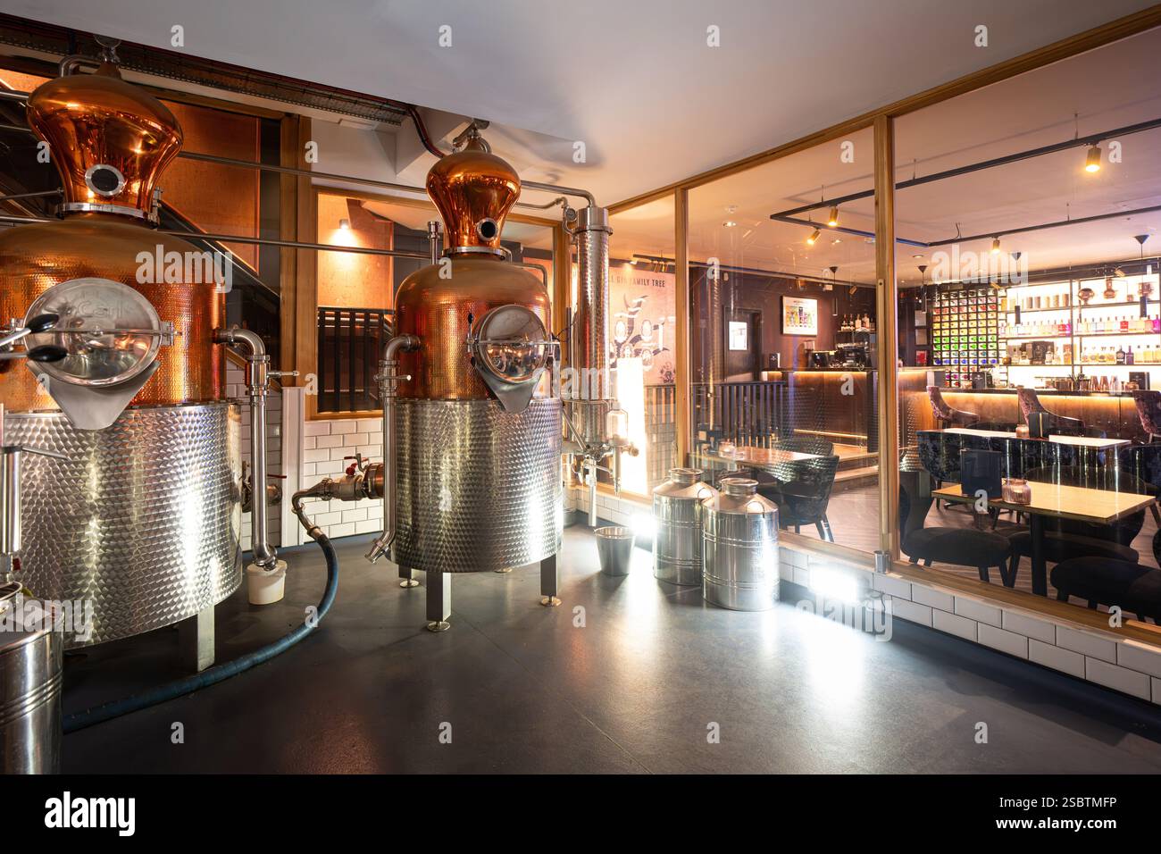 Copper and stainless steel stills used for distilling spirits, visible ...