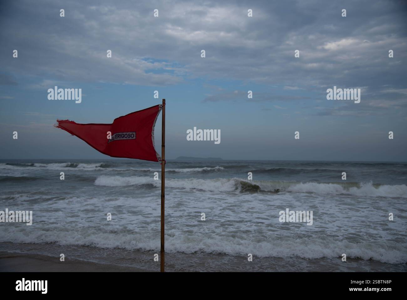 Flag indicating "dangerous sea" at Praia da Gamboa on the coast of ...