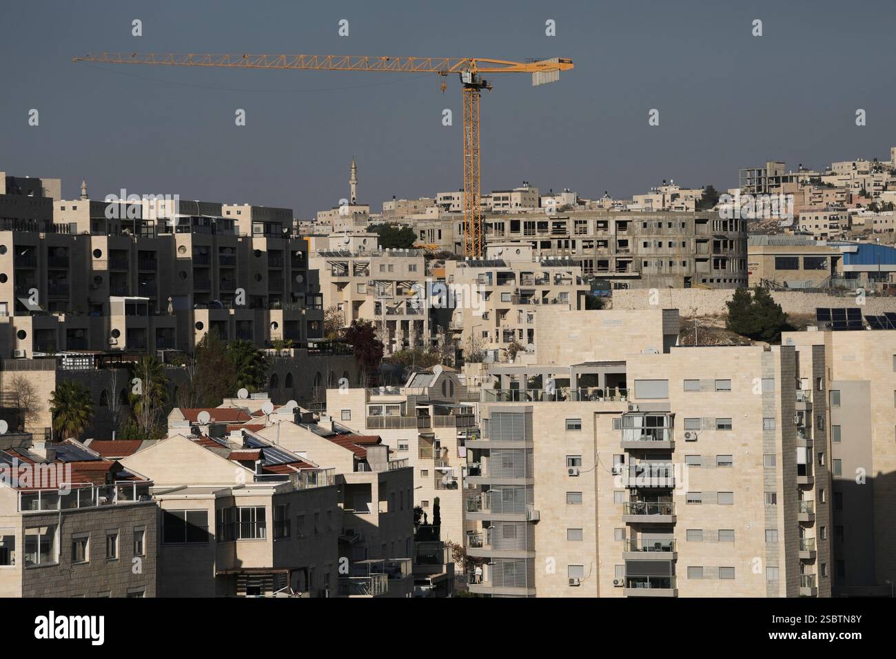 A crane stands at a construction site in Har Homa, an Israeli ...