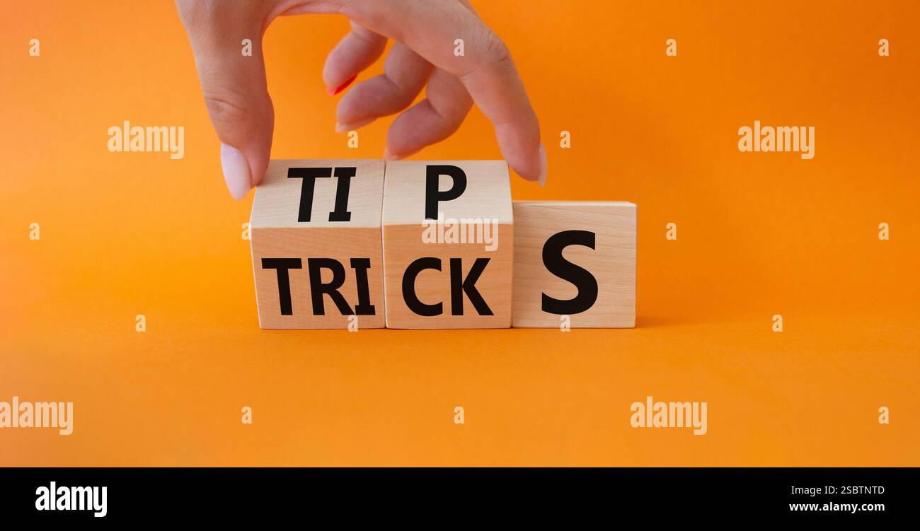 Tips and Tricks symbol. Businessman Hand turns cubes and changes word ...